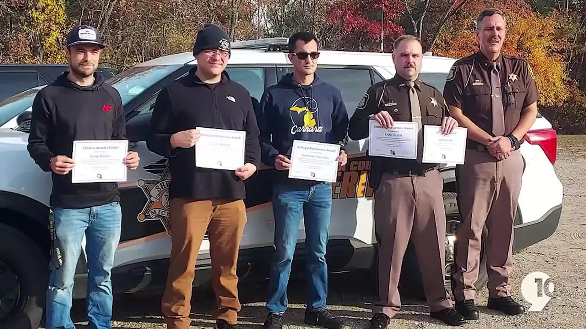 Several Northern Michigan men honored for life-saving river rescue of ...
